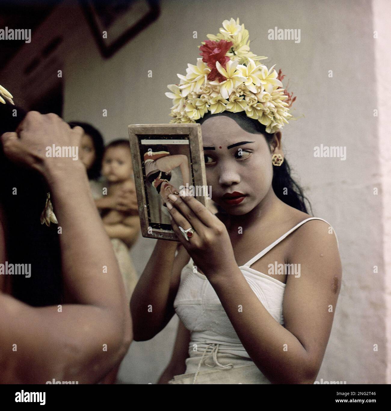 Female Barong dancer applying makeup in Bali. (AP Photo Stock Photo - Alamy