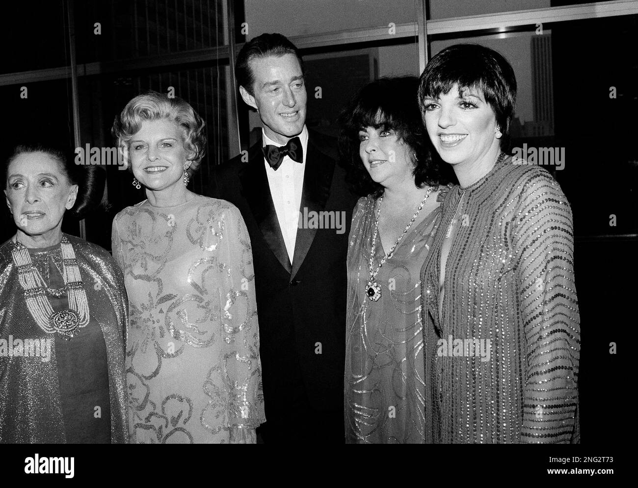 Roy Halston, center, poses in his New York showroom Monday night, May ...
