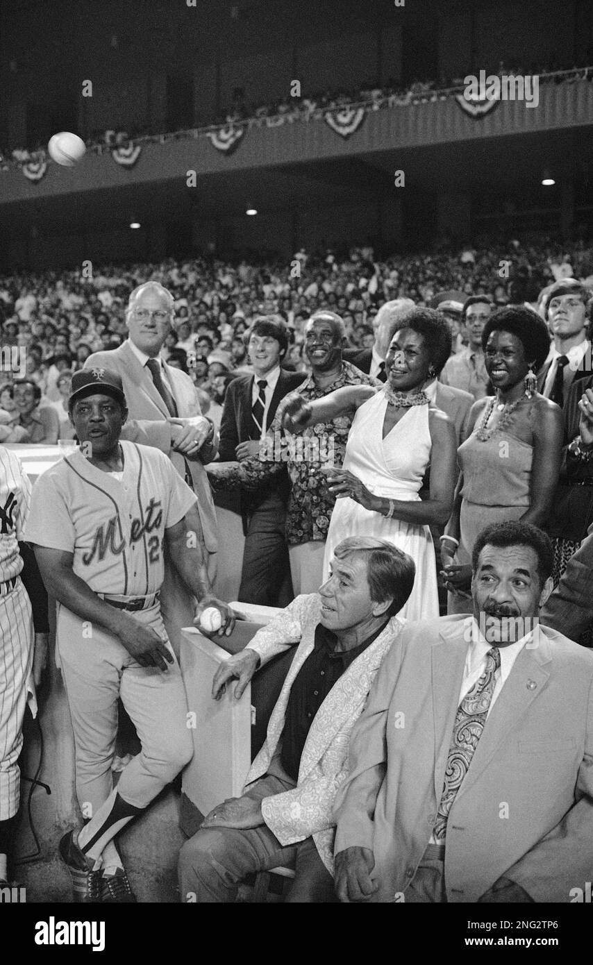 Mrs. Rachel Robinson, white dress, tosses out ceremonial first pitch ...