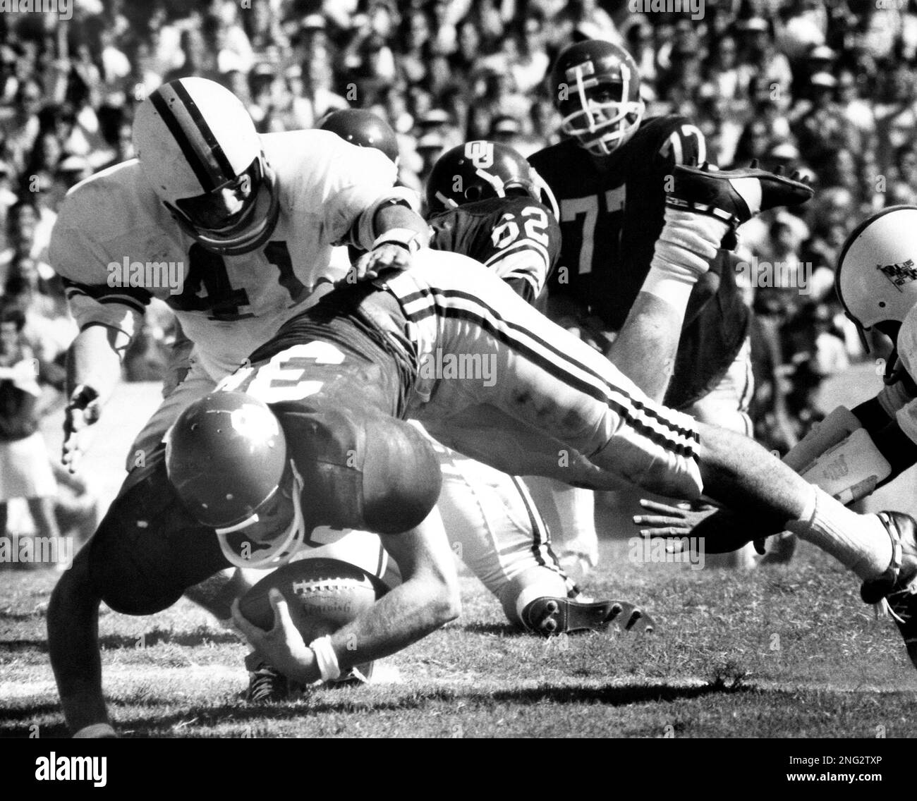Tailback Steve Owens is stopped by Maryland defensive back Lou Stickel ...