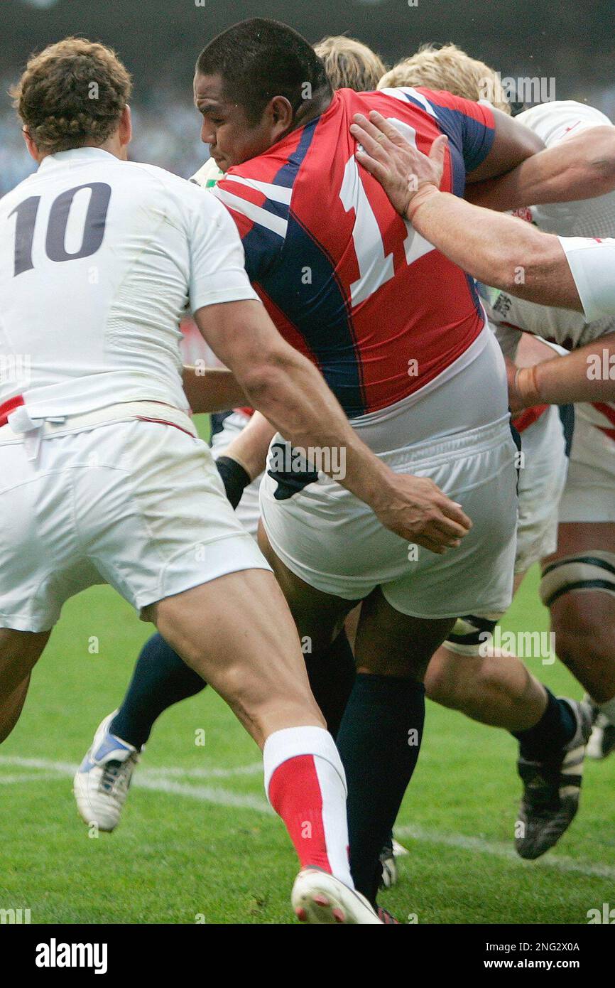 Matekitonga Moeakiola of the United States, center, breaks through ...
