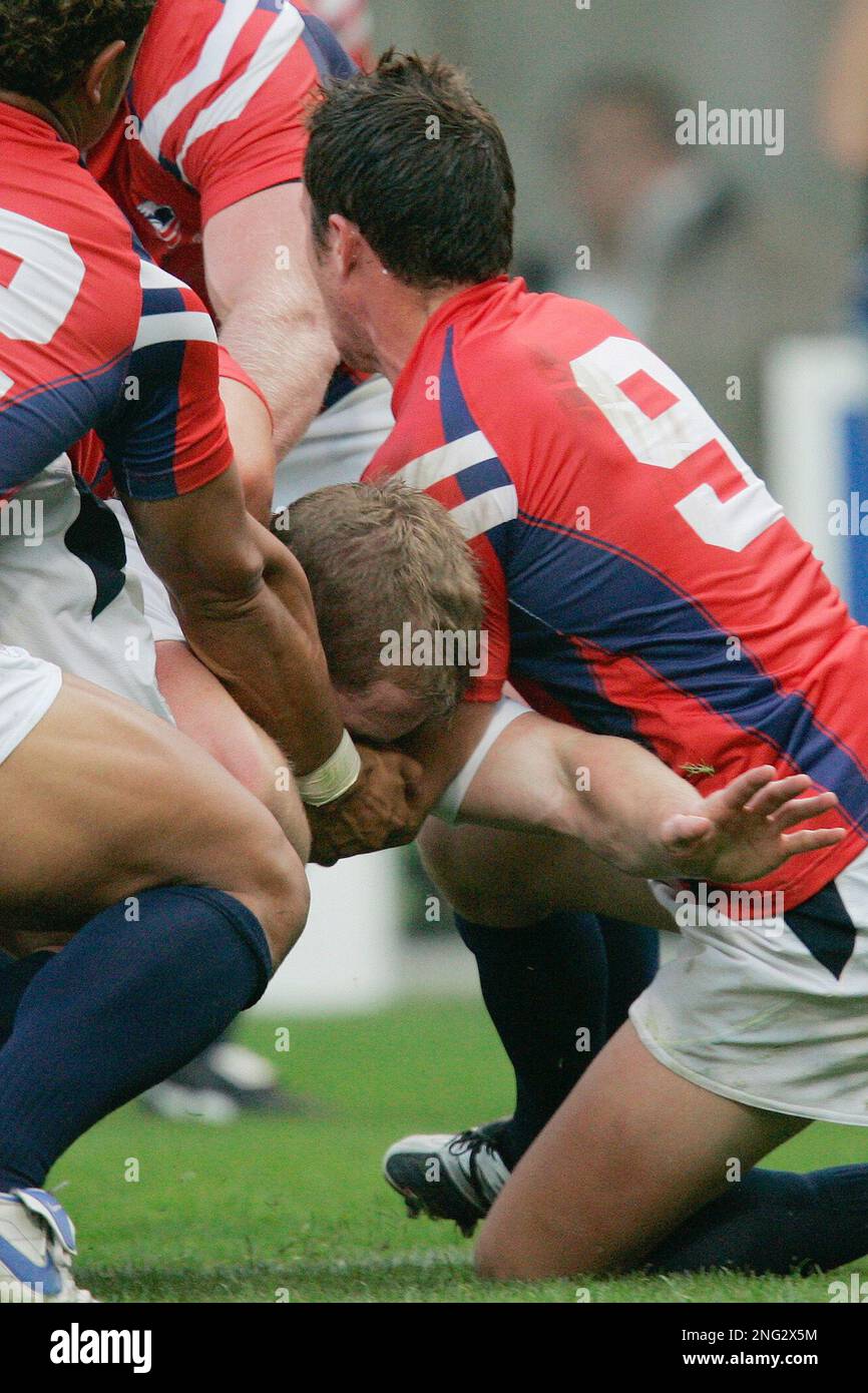 Tom Rees of England reaches out through the United States defense to ...