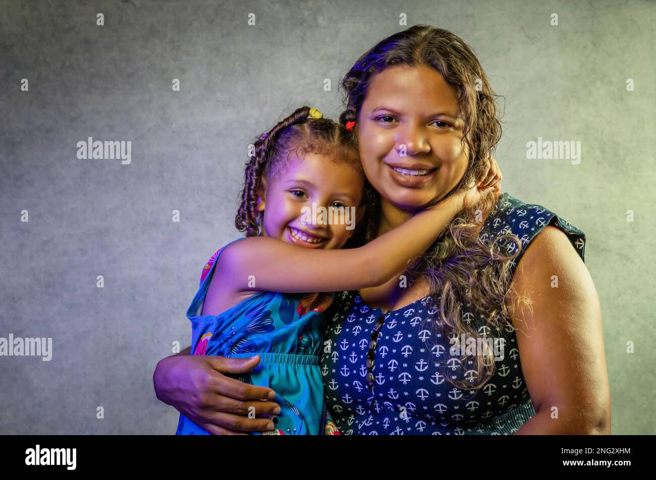 Mother And Daughter Hugging Smiling For Portrait Brazilian Black Women
