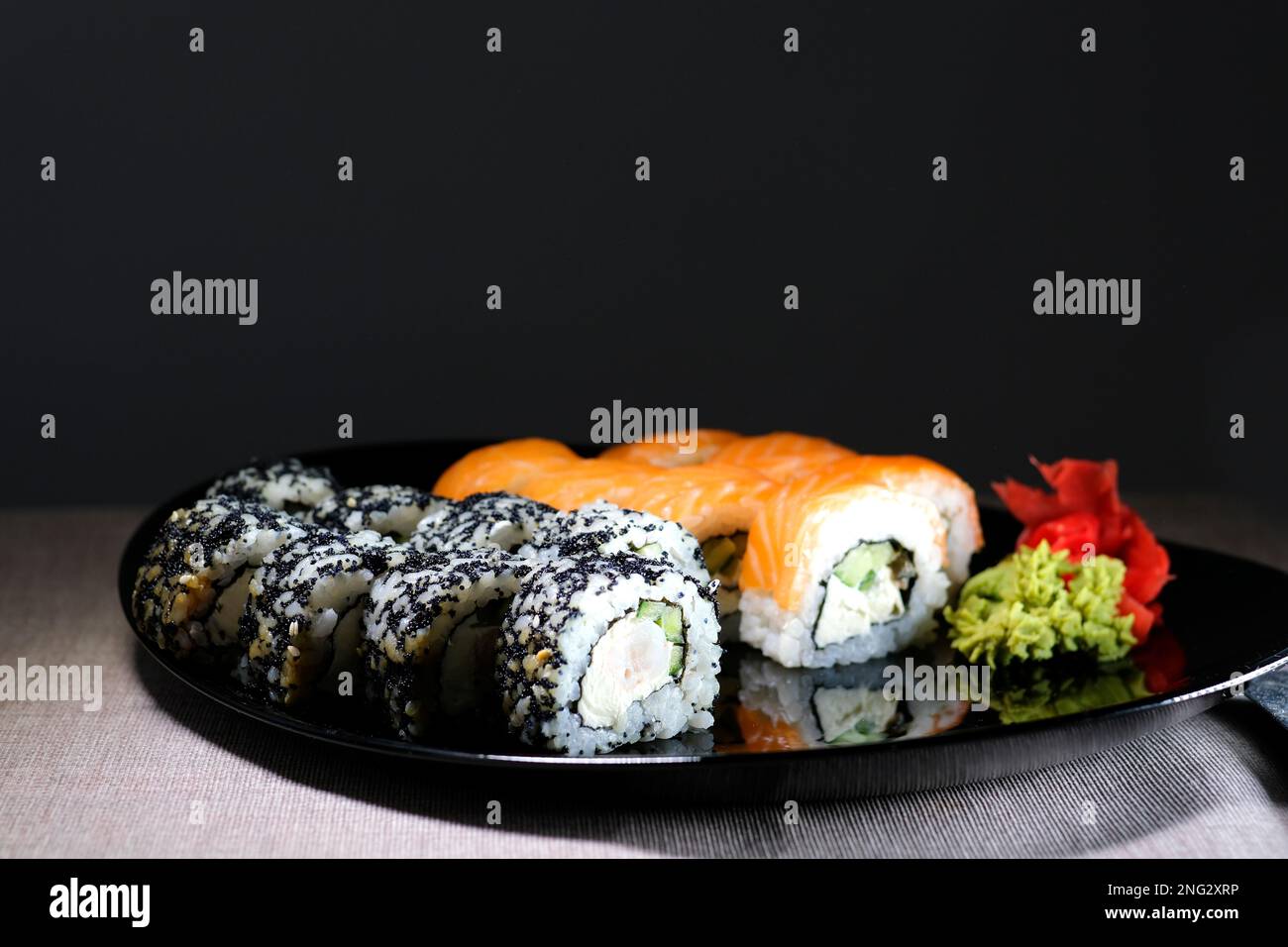 Eating Sushi with chopsticks. Sushi roll japanese food in restaurant ...