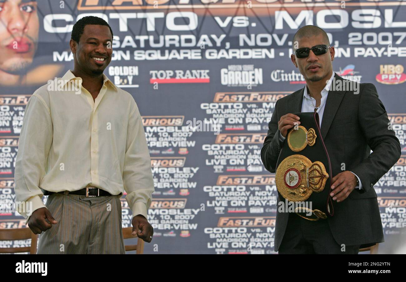 Boxers Miguel Cotto, right, holding his WBA title belt, and Sugar Shane ...