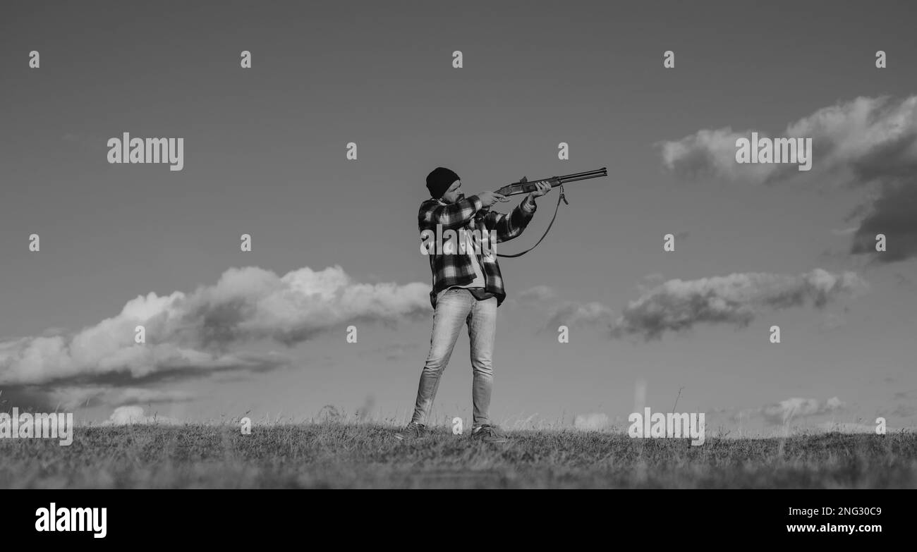 Hunter with Powerful Rifle with Scope Spotting Animals. Hunter in the ...