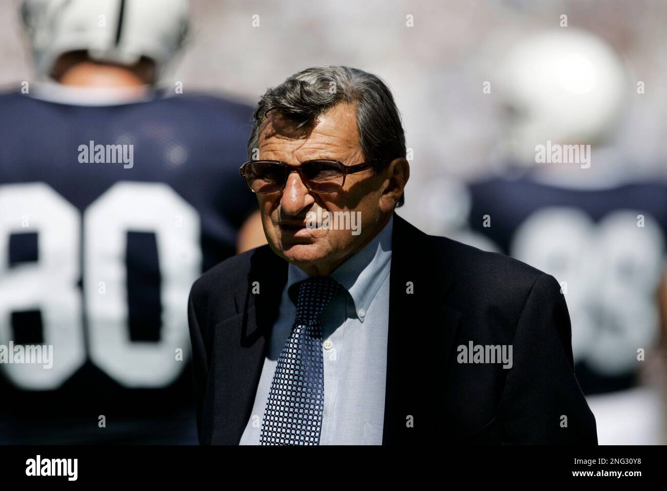 Penn State coach Joe Paterno walks the field as his team warms up ...