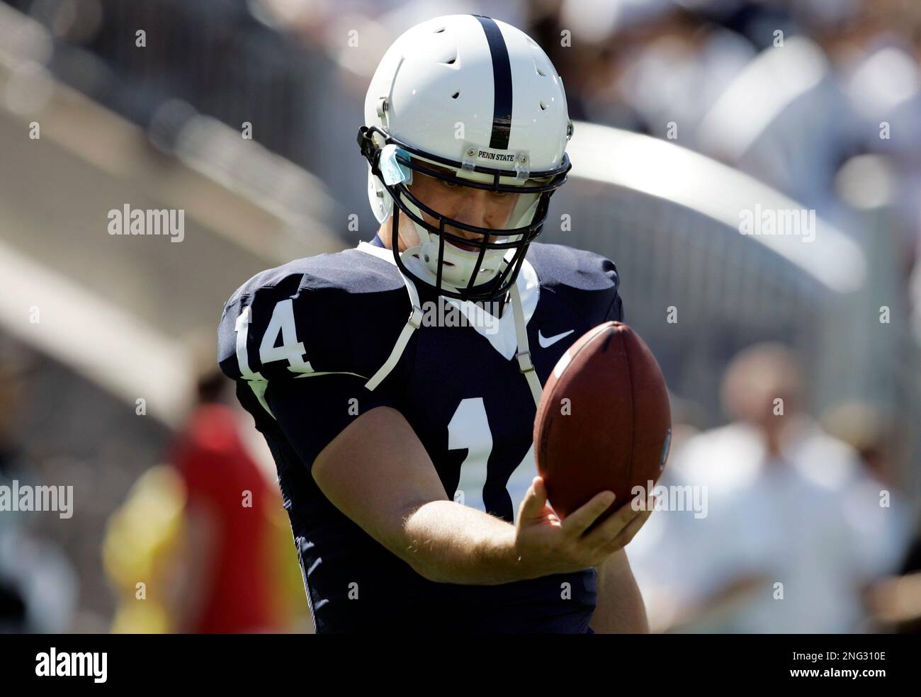 Penn State starting quarterback Anthony Morelli examines a ball during ...