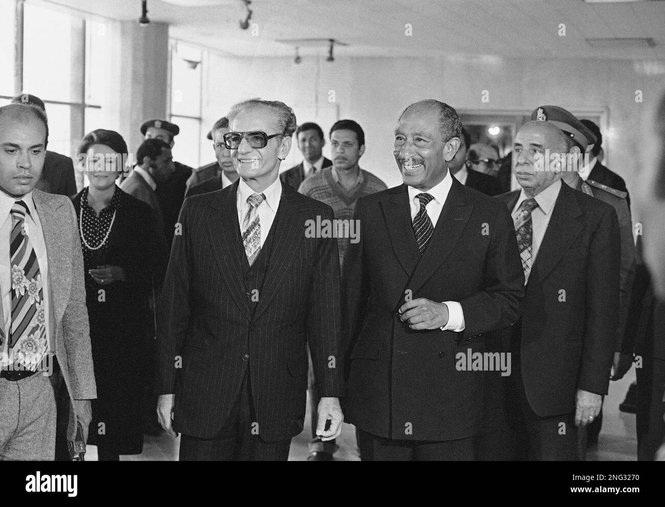 Egyptian President Anwar Sadat and the Shah of Iran smile upon arrival ...
