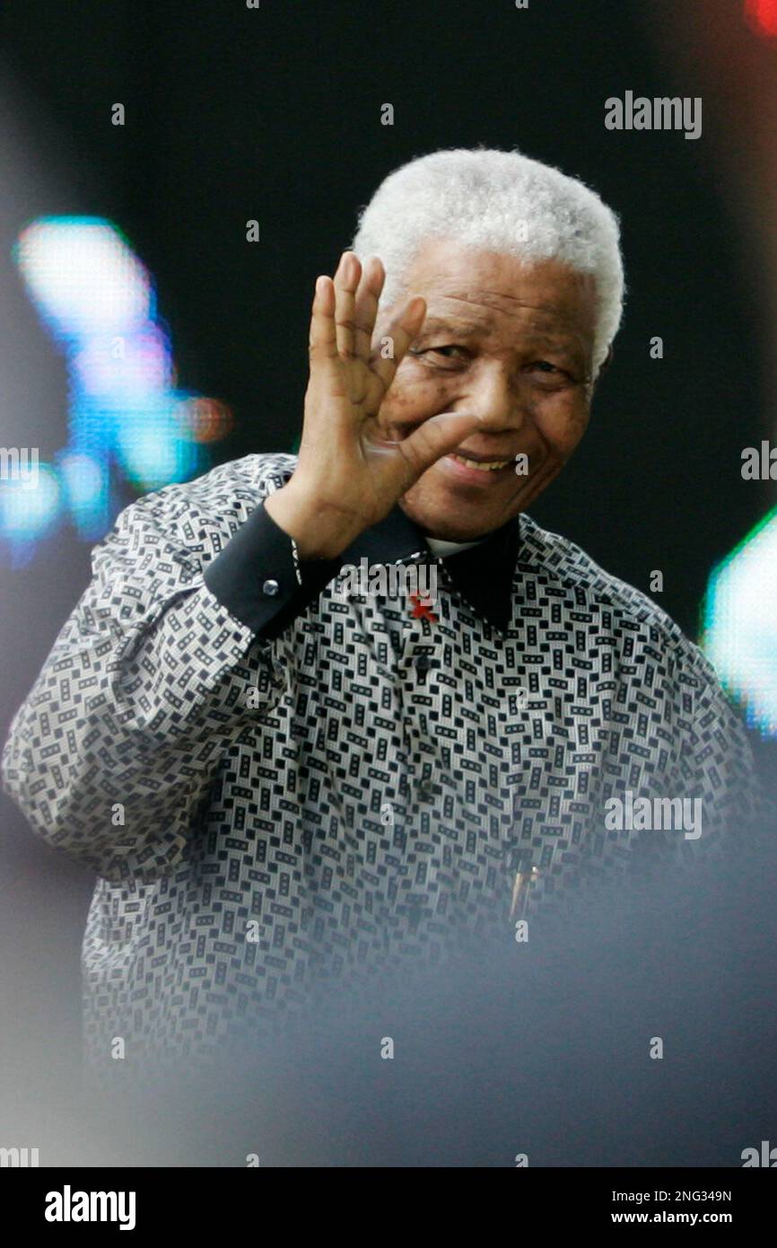 Nelson Mandela, former President of South Africa, waves to the crowd as ...