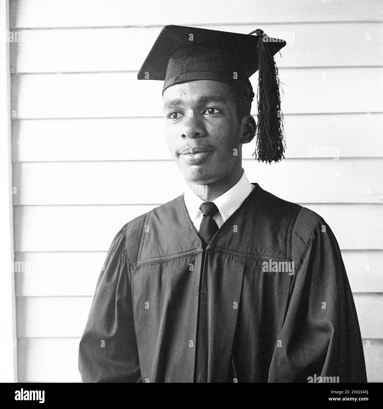 Seventeen year old Ernest Green poses in the cap and gown he will wear ...