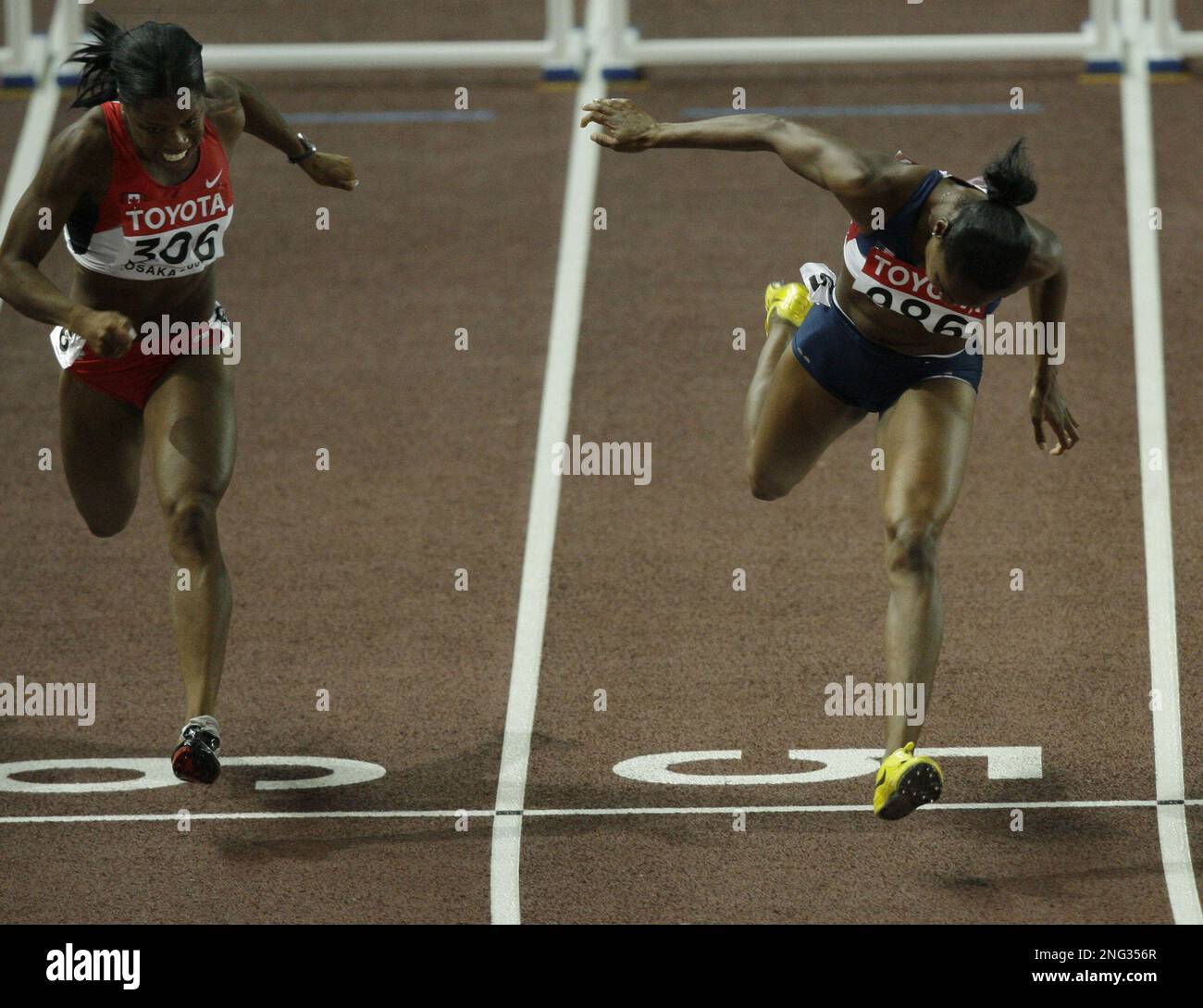 Canada's Perdita Felicien, left, and USA's Michelle Perry cross the ...
