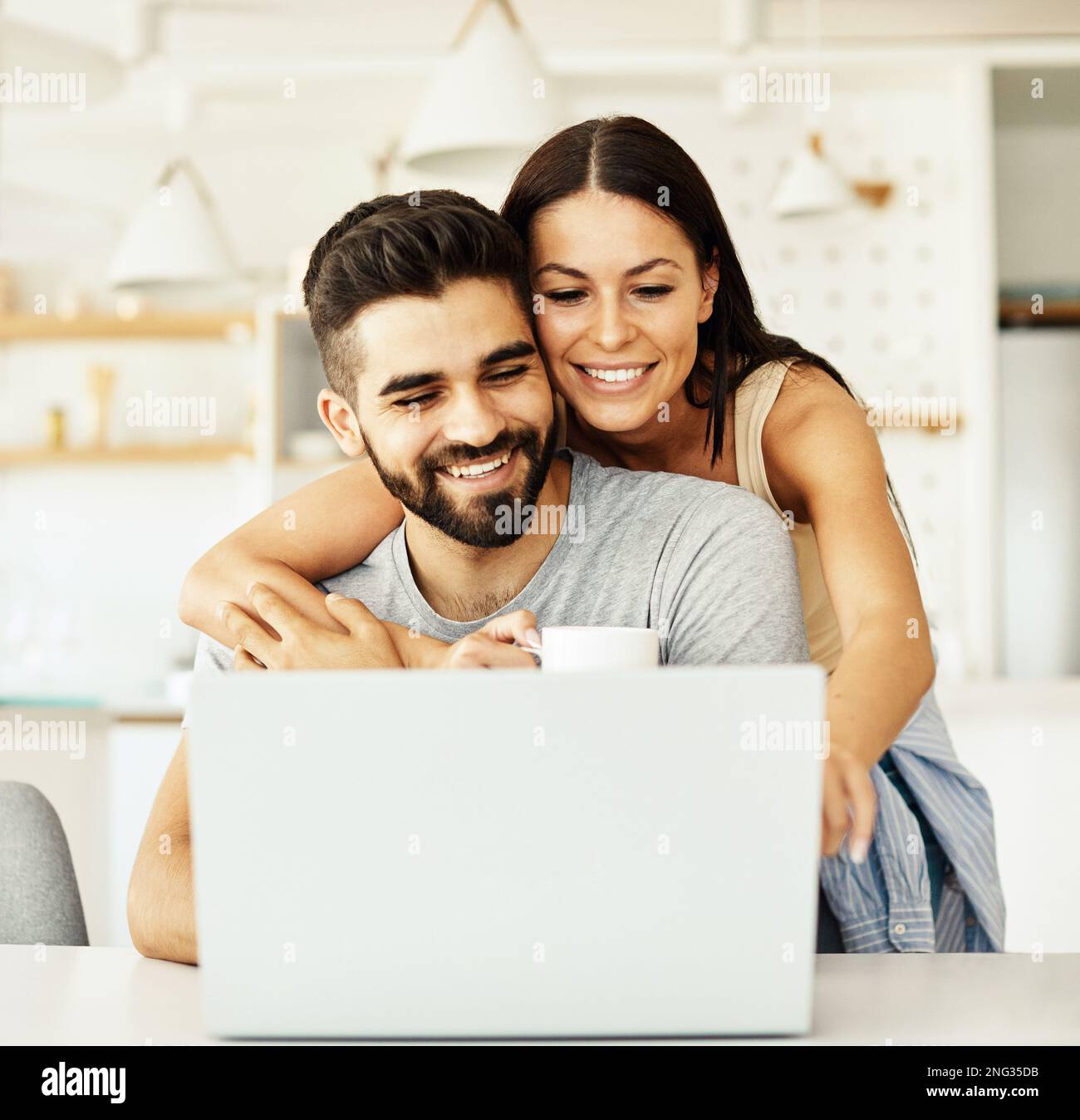laptop woman man couple computer indoor technology young together lifestyle happy home love ...