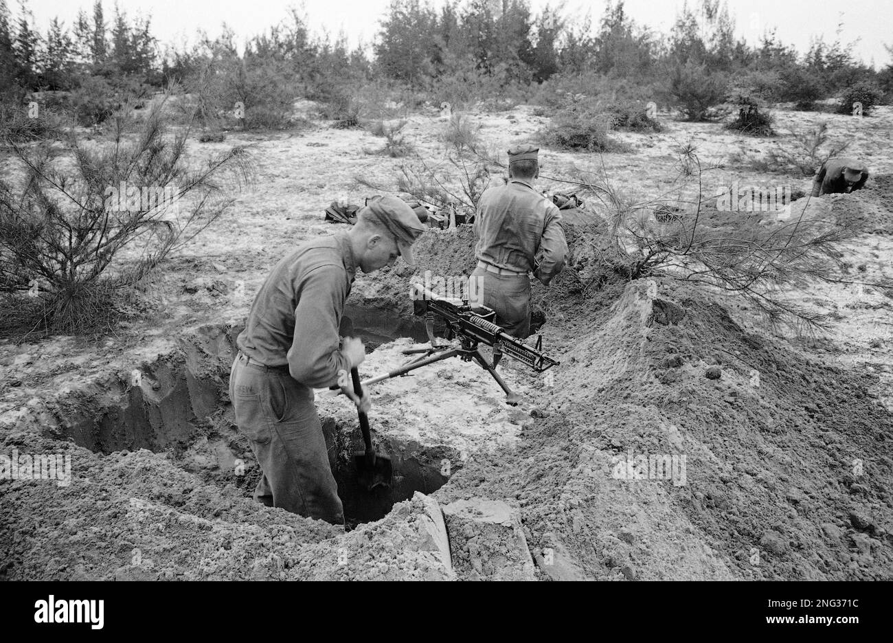 U.S. Marines dig in for a Bazooka position at Danang Airfield, March 9 ...