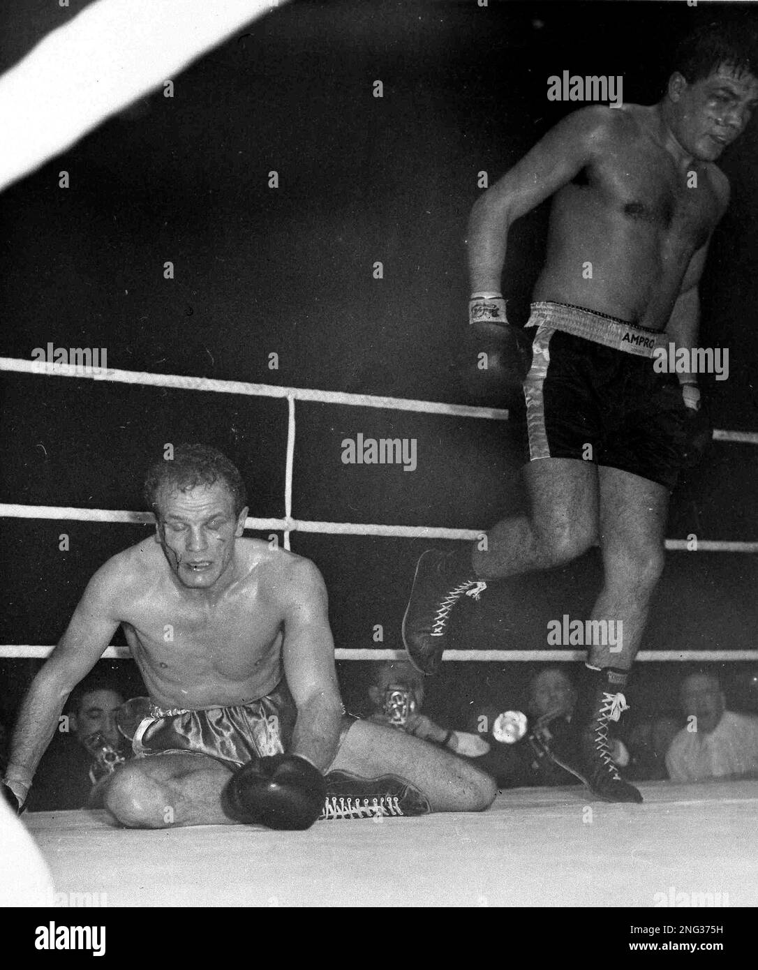 British Heavyweight boxing champion Henry Cooper drops to the canvas in ...