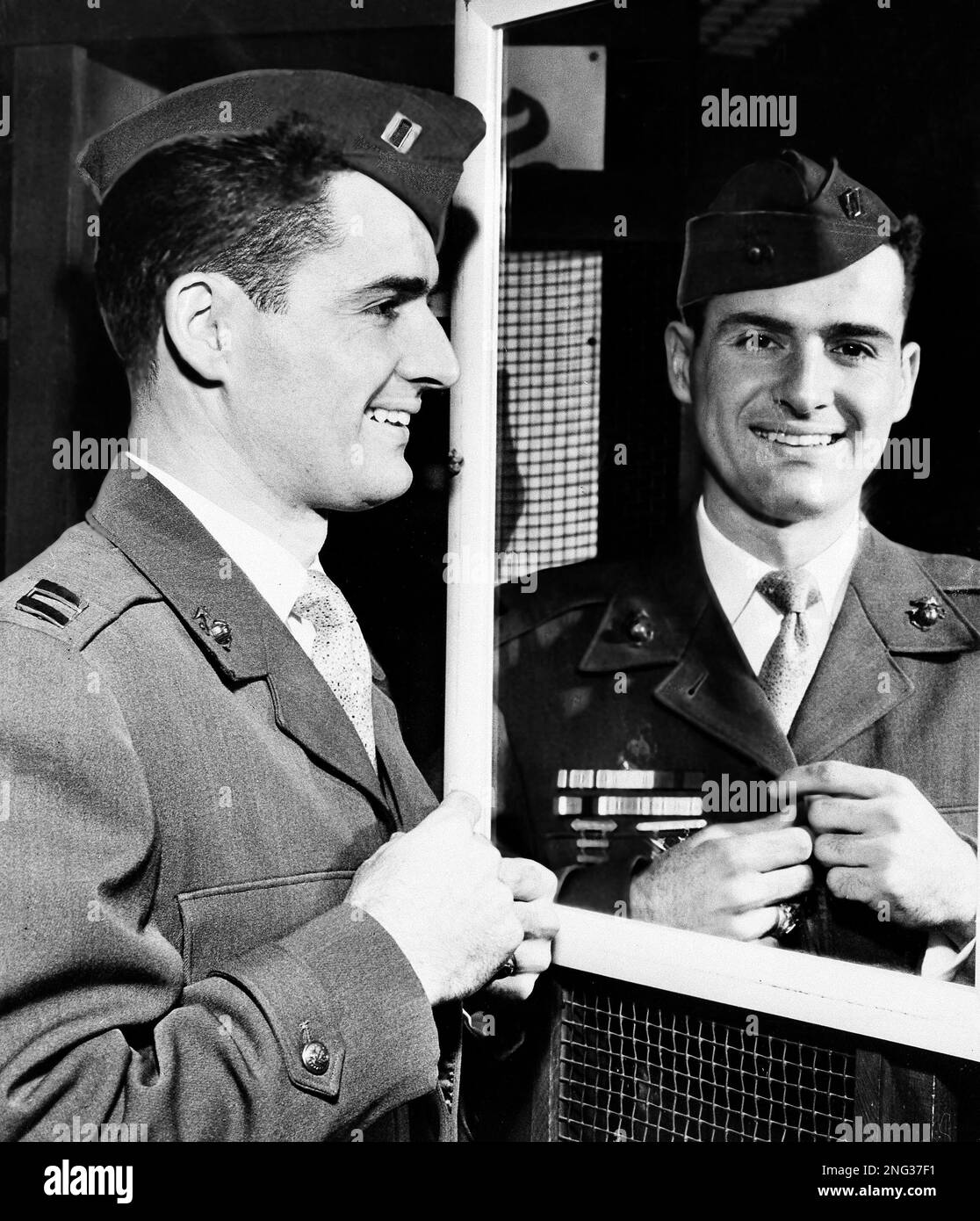 New York Yankee infielder Jerry Coleman , trys on a uniform in San ...