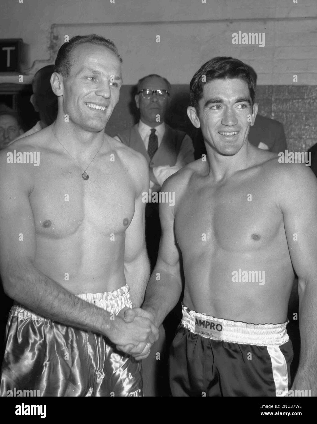 British and Empire Heavyweight boxing champion Henry Cooper, left, shakes hands with Roy Harris ...