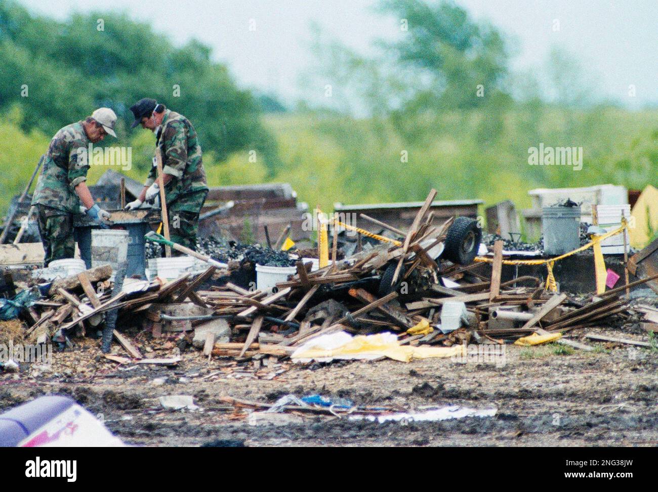 Workers continue to sift through the burned Branch Davidian compound ...