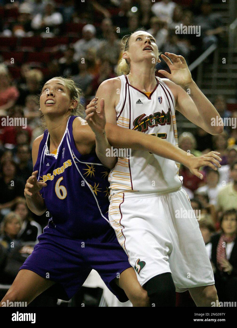 Seattle Storm's Lauren Jackson, right, and Los Angeles Sparks' Sidney Spencer vie for rebounding ...