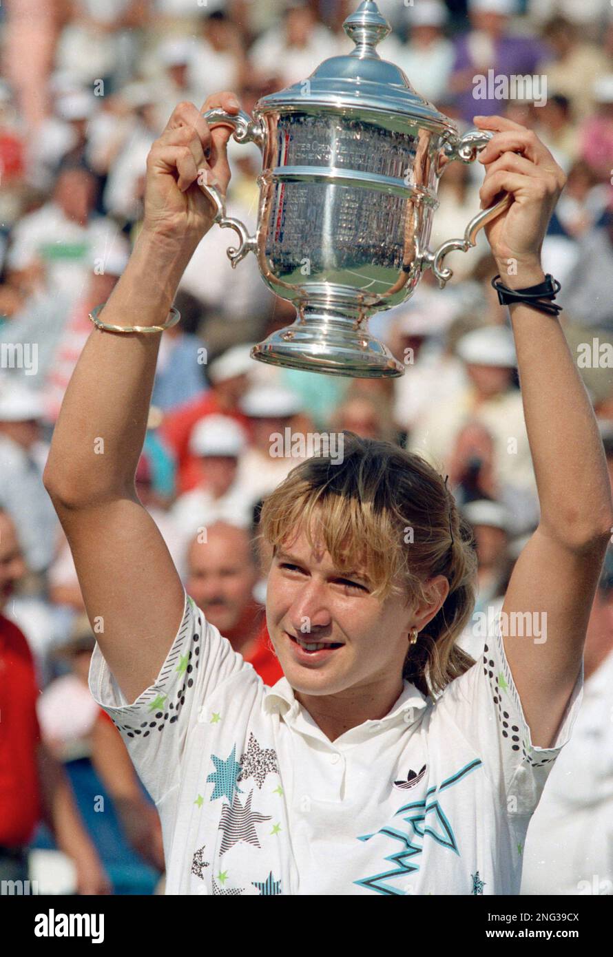 West Germany's Steffi Graf holds the U.S. Open Women's Singles trophy ...