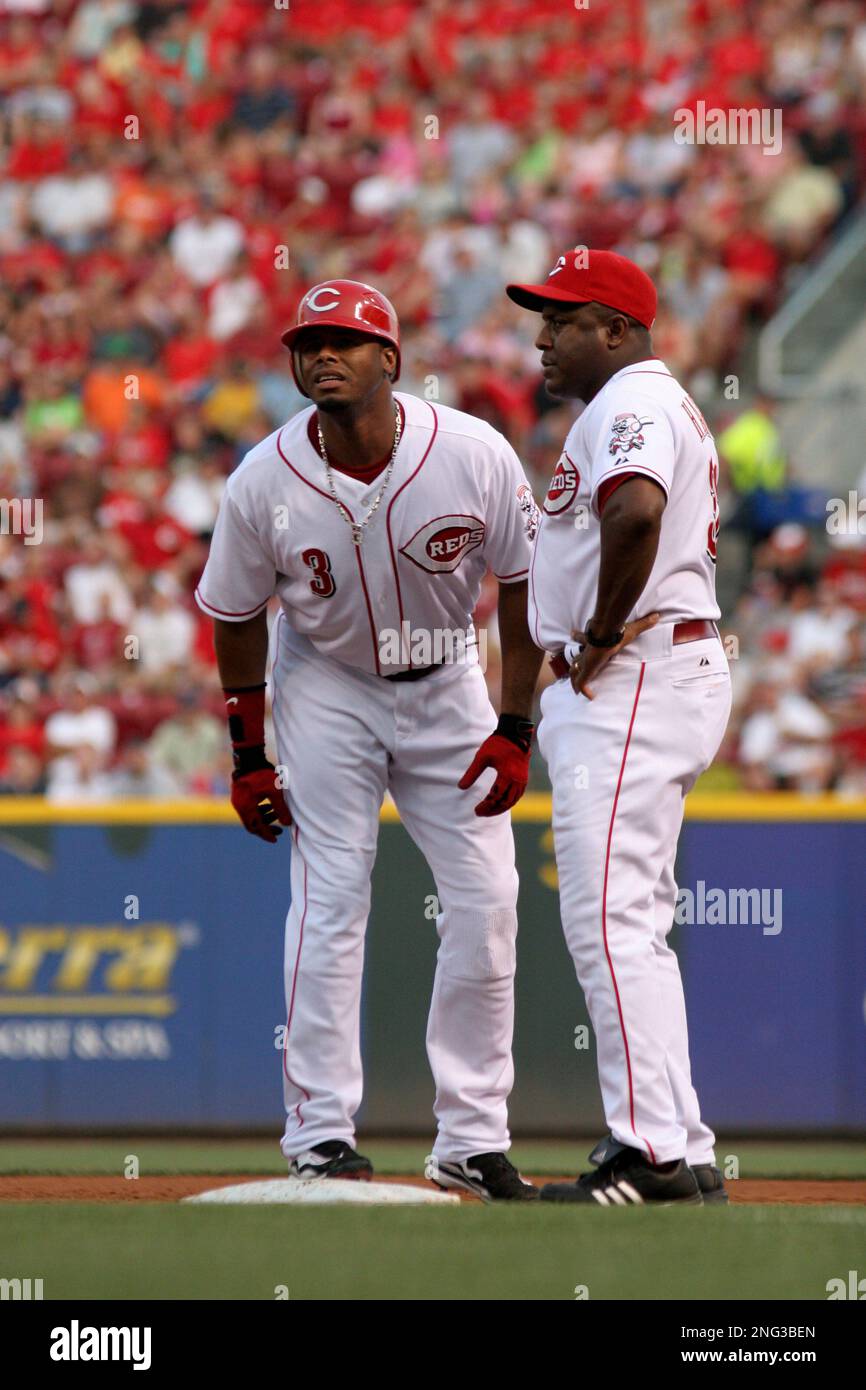 Cincinnati Reds' Ken Griffey Jr. (3) with first base coach Billy ...