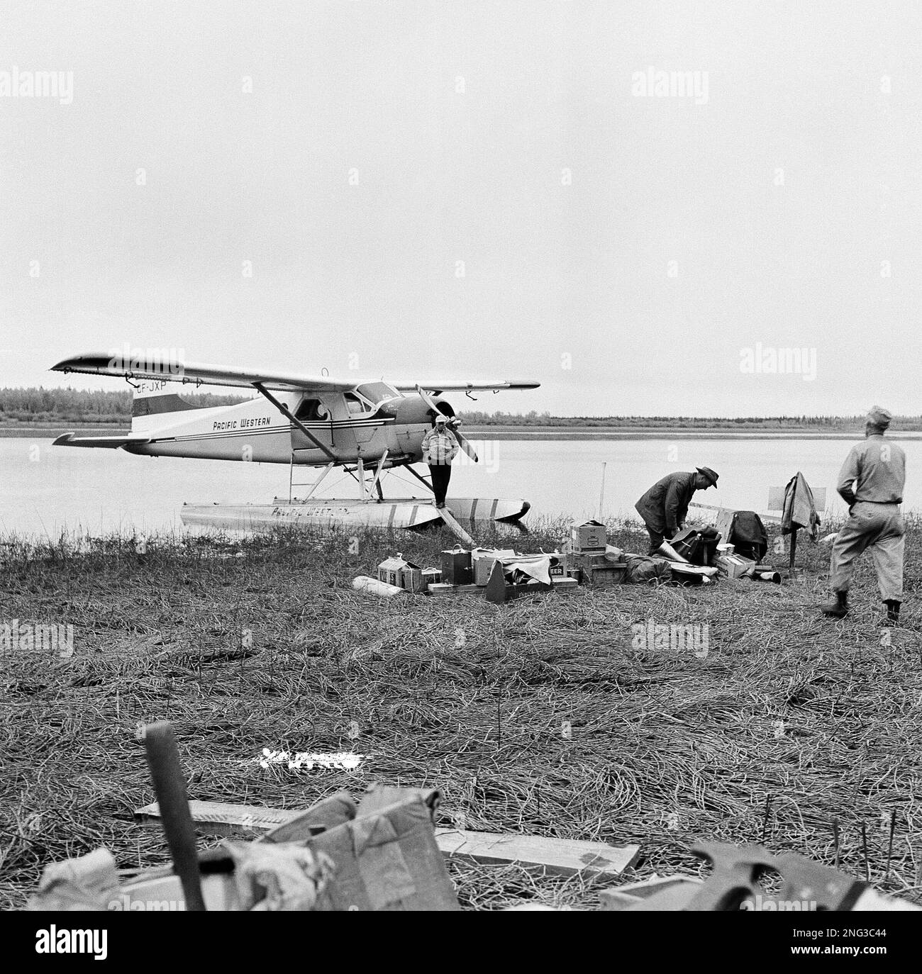 Bush pilot Pat Carey stands on the pontoon of his Pacific Western ...