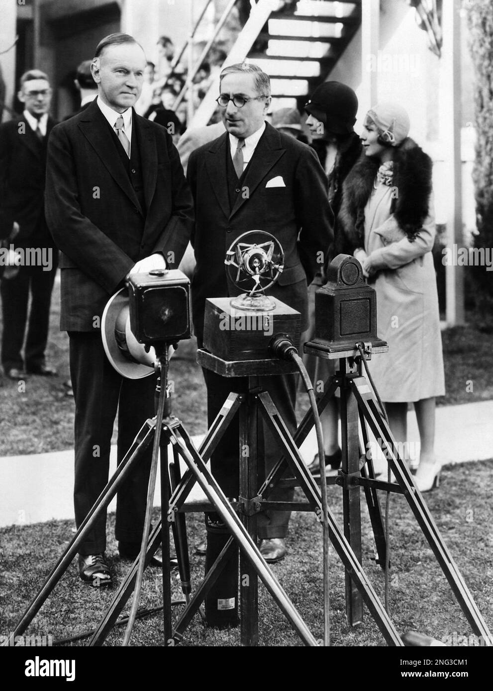 Former president Calvin Coolidge faces the microphone at the opening of ...