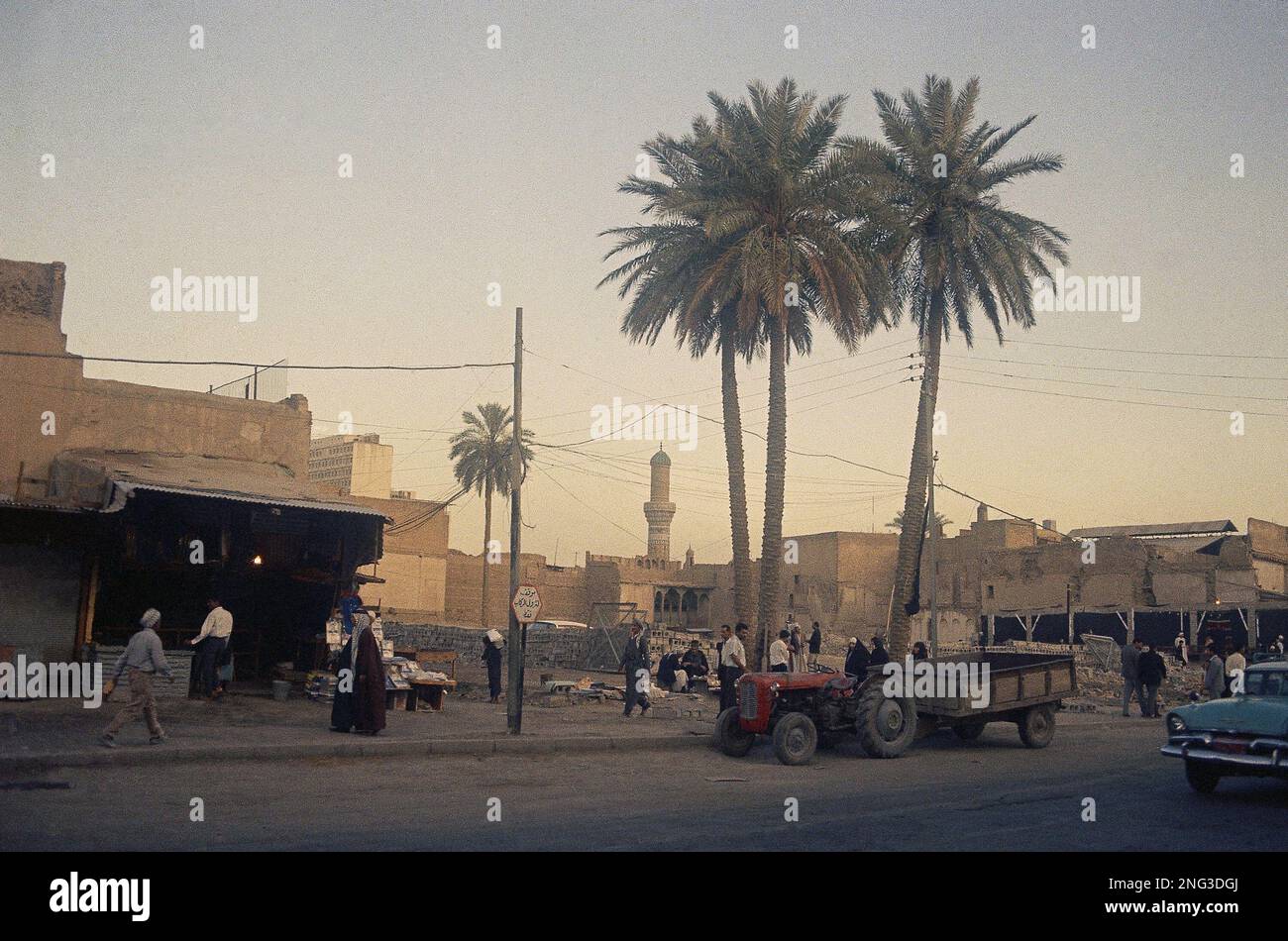 Palm trees outline minaret of mosque in old Baghdad. Undated photo. (AP ...