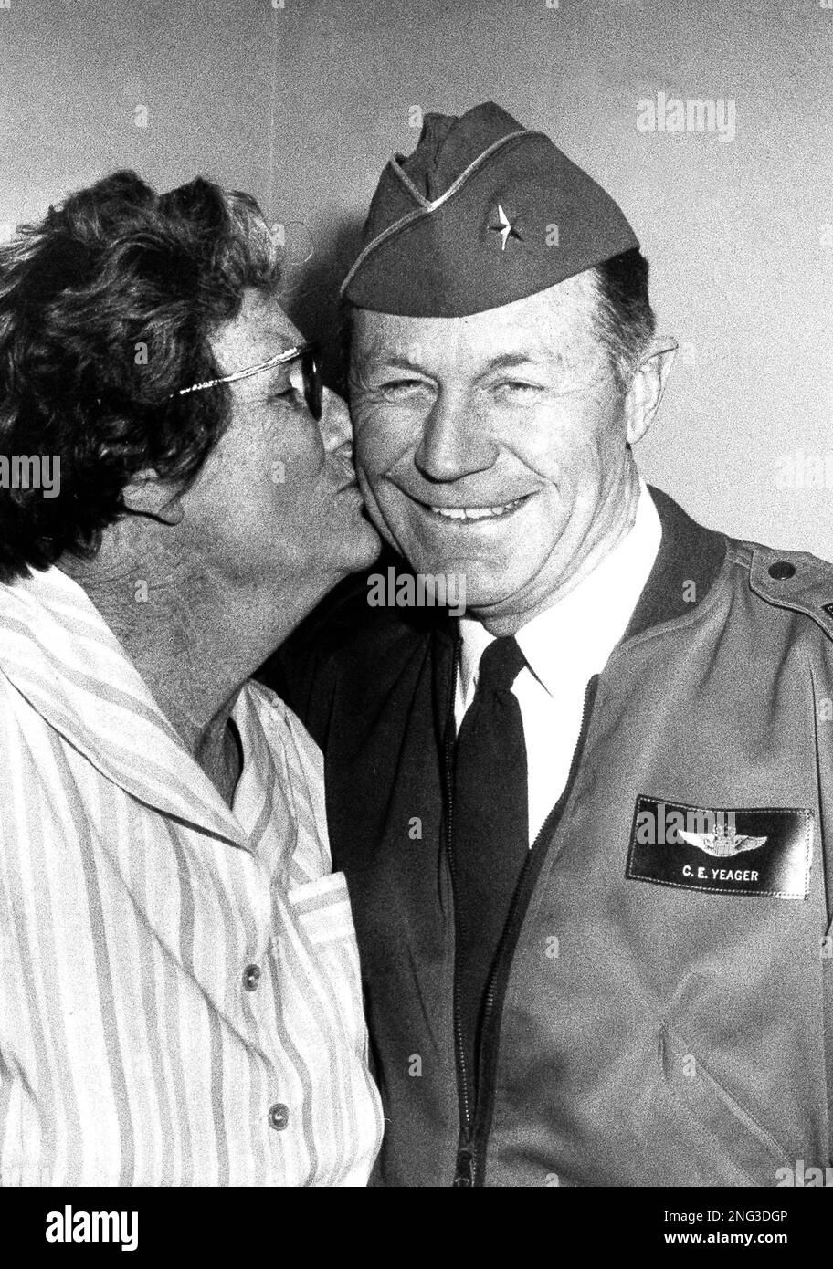 Susie Yeager plants a kiss on the cheek of her supersonic son, Brig. Gen. Chuck Yeager, the man ...