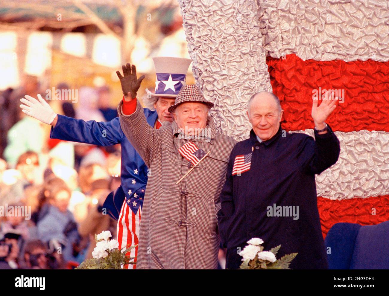 Retired test pilot Chuck Yeager, right, and comedian Bob Hope, wave ...
