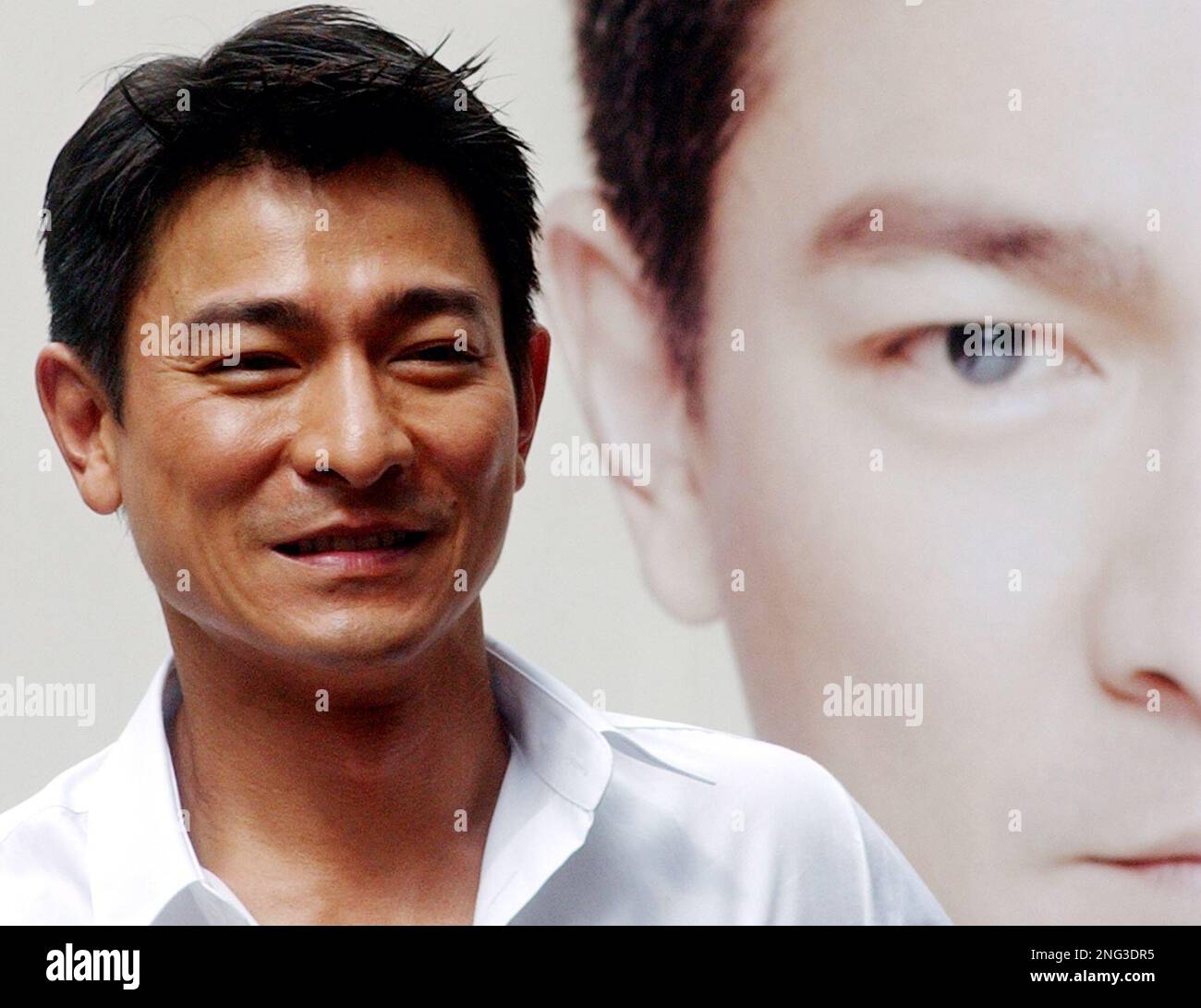 Hong Kong actor and singer Andy Lau poses for photographers at a new ...