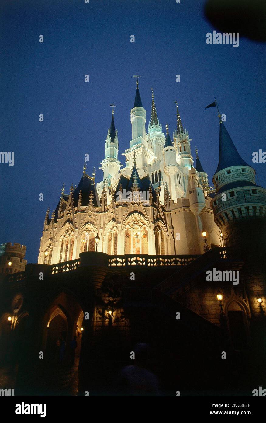 Castle lit up at night at Disneyland in Tokyo, Japan, March 1983. (AP ...