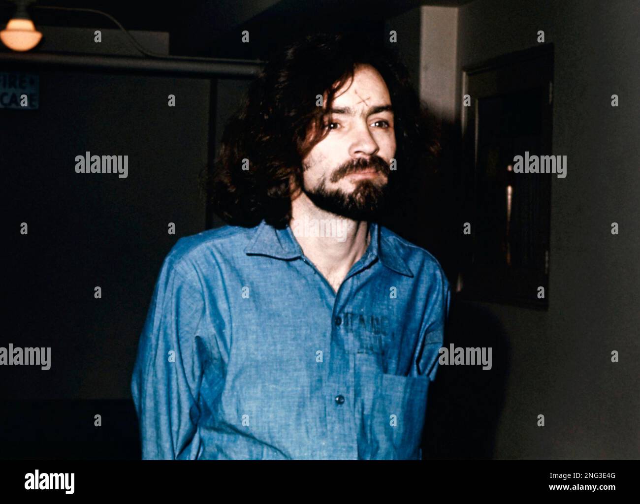 Charles Manson appears in court at the start of his trial with an "X ...