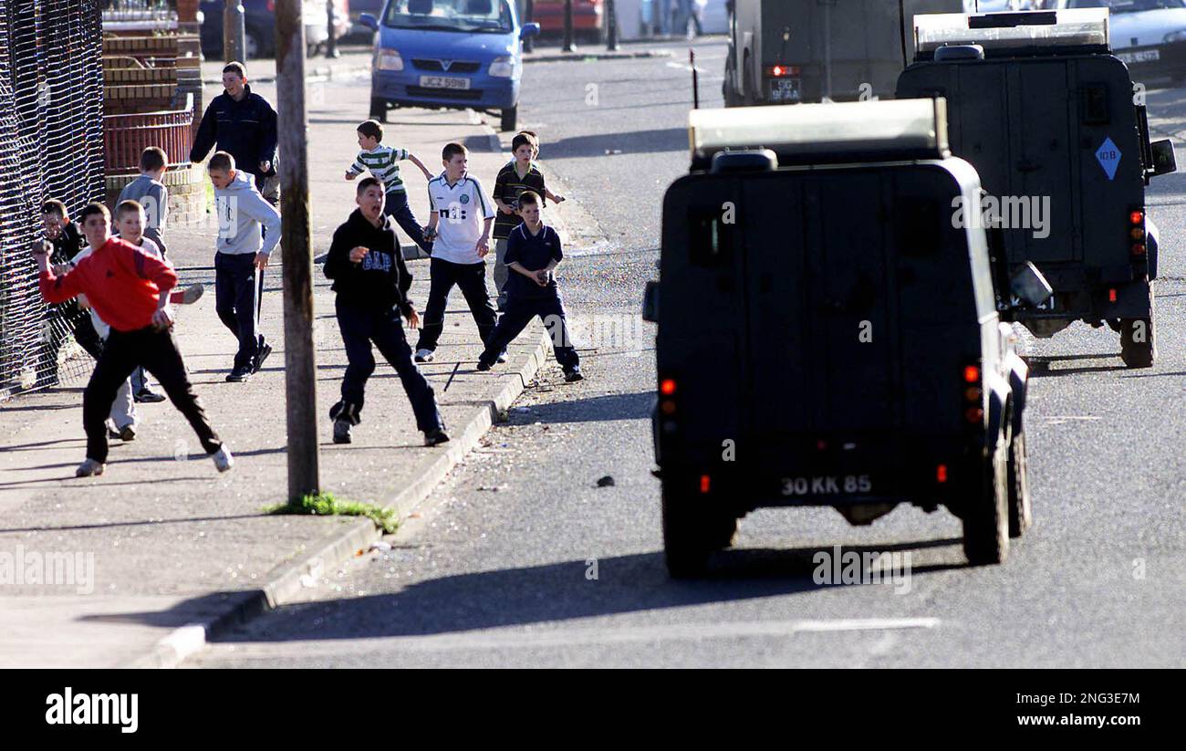 Catholic youths attack the British Army as they patrol the Ardoyne area ...