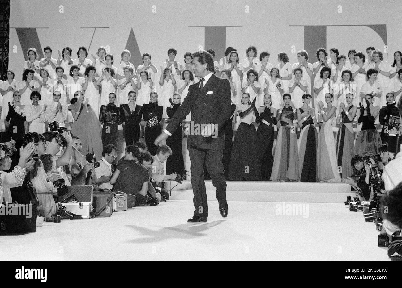 Italian fashion designer Valentino acknowledges press and photographers ...