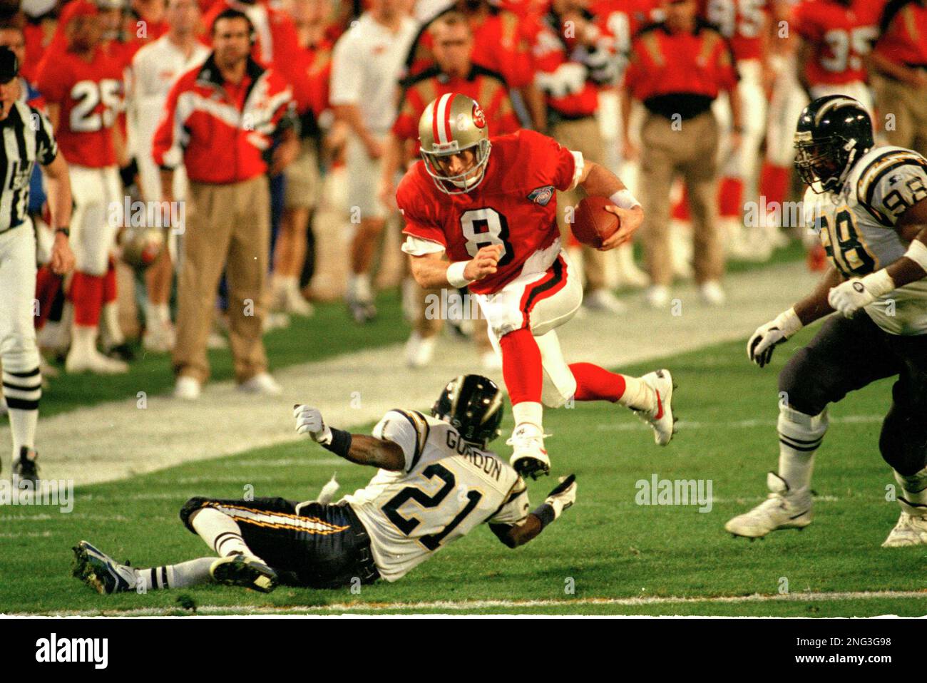 San Francisco 49ers' quarterback Steve Young (8) runs over San Diego's ...
