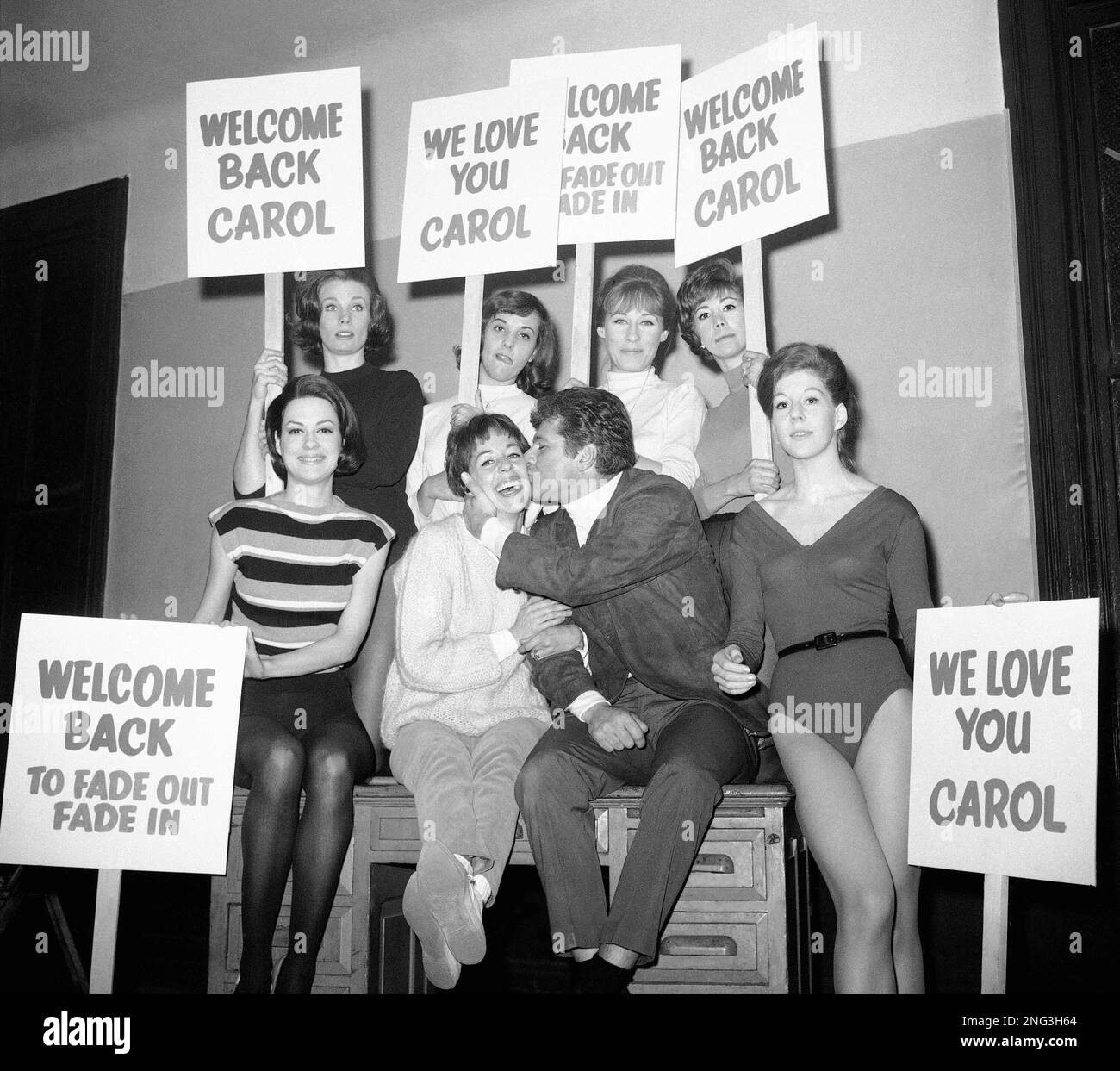 Comedienne Carol Burnett,center, gets kiss from co-star Dick Shawn with ...