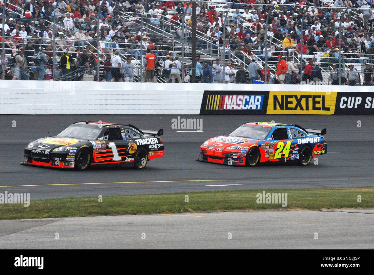 NASCAR driver Martin Truex Jr. (1) passes Jeff Gordon (24) during the ...