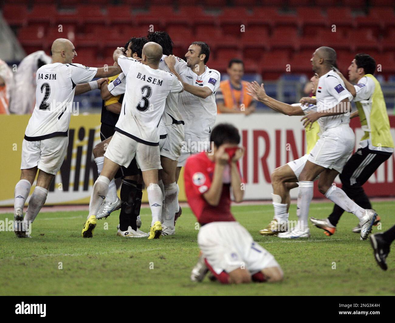 Iraq's players celebrate after winning against South Korea during 2007 ...