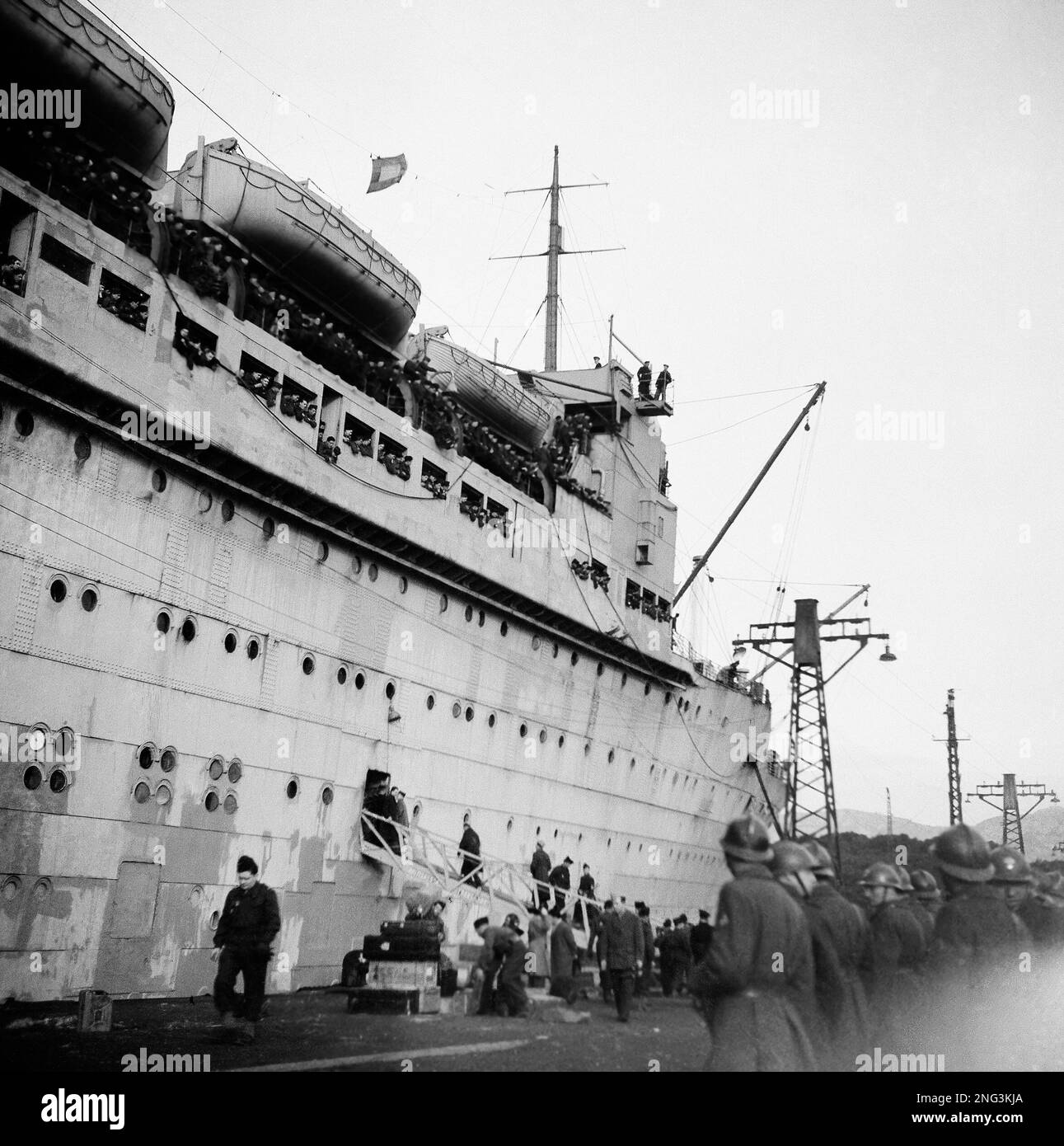 French troops line the rails of the liner Ile De France as others ...