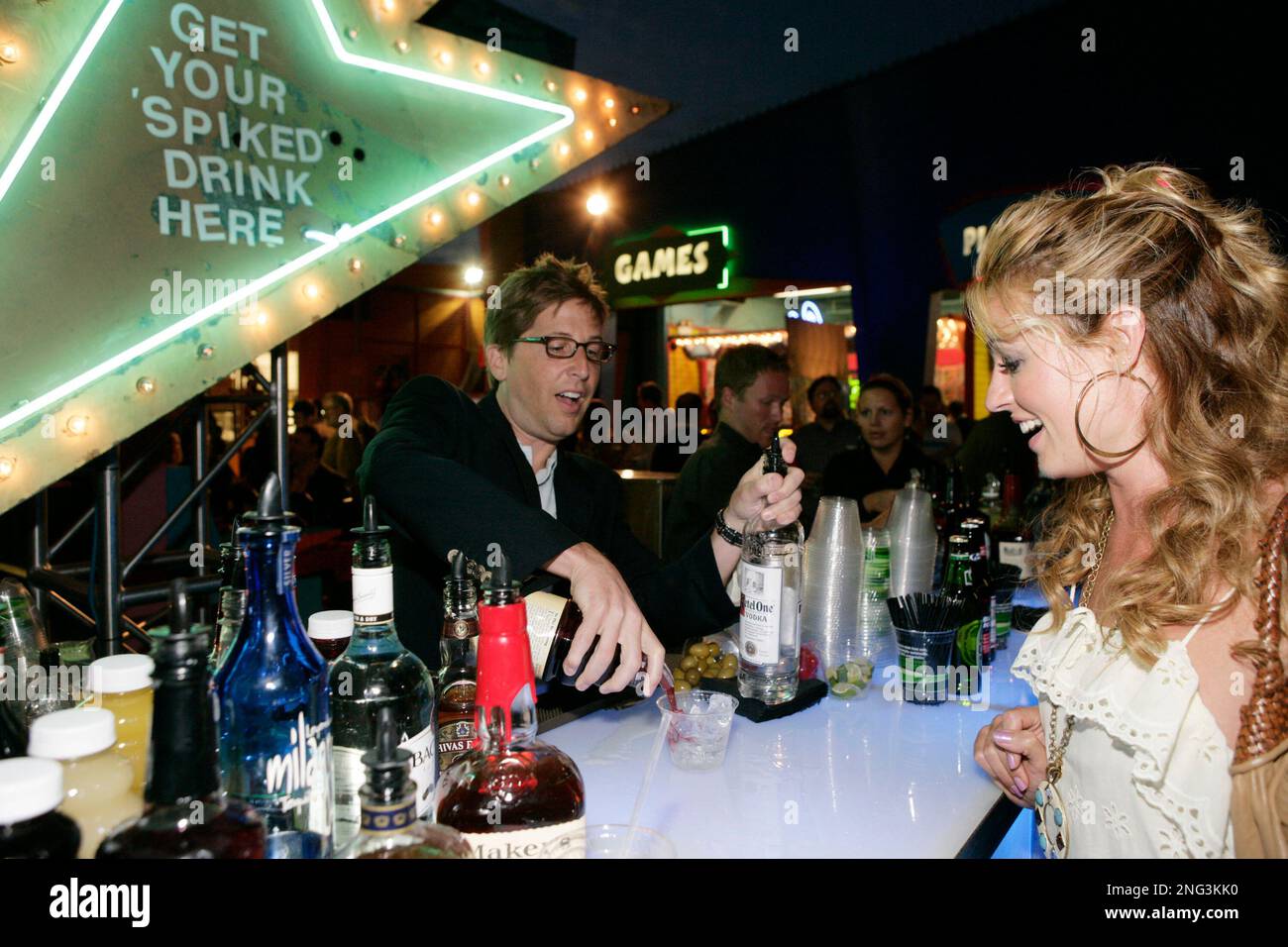 Spike Feresten, left, makes a drink for Cat Deeley at the the annual ...