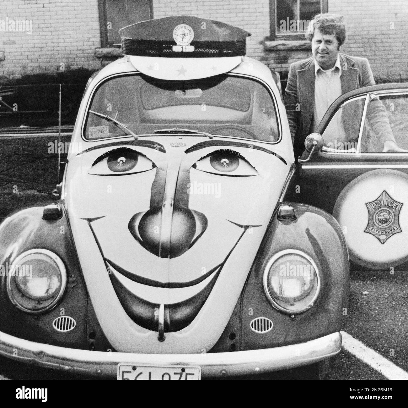 Fitchburg Police Youth officer, Det. Sgt. James R. Conry, stands beside ...