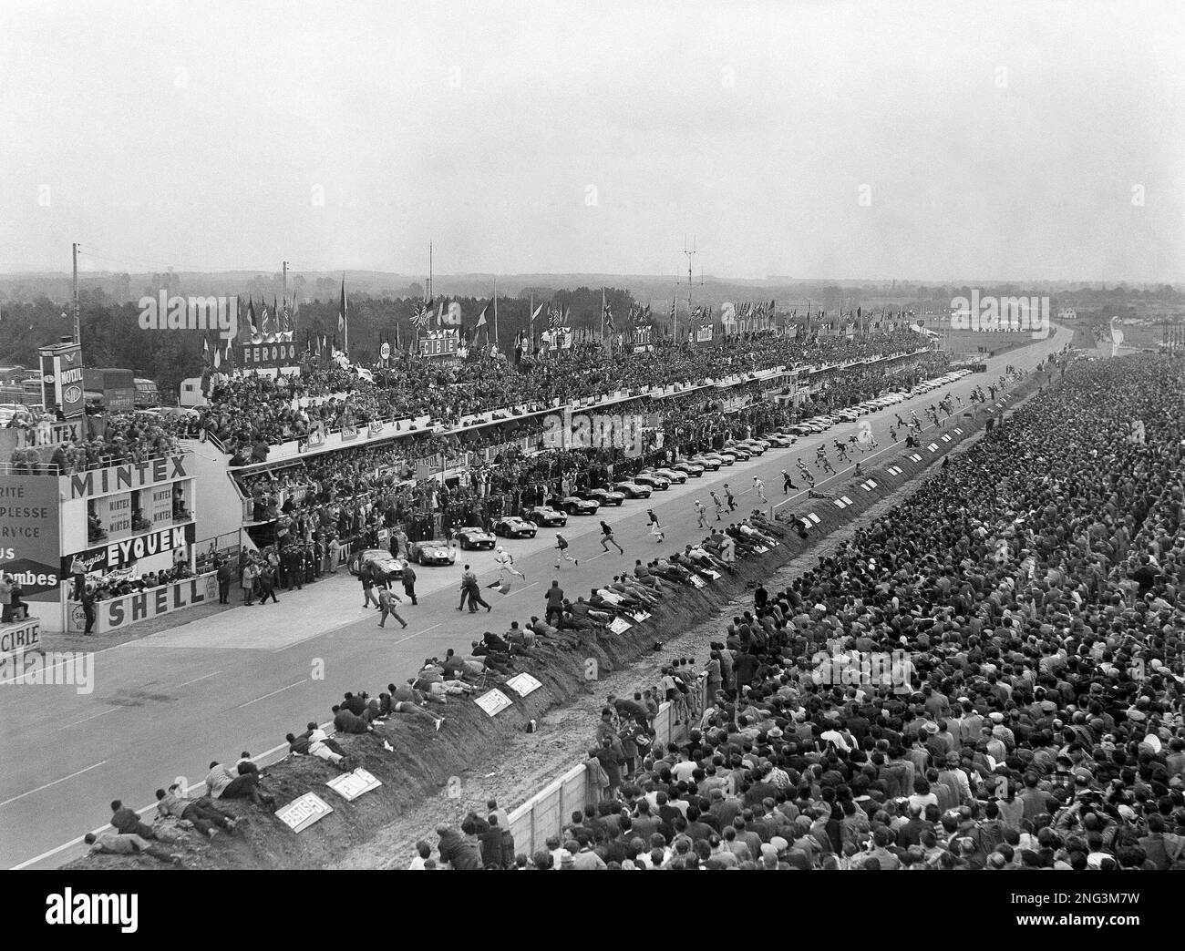 Drivers sprint across the track to their cars in the traditional "Le ...