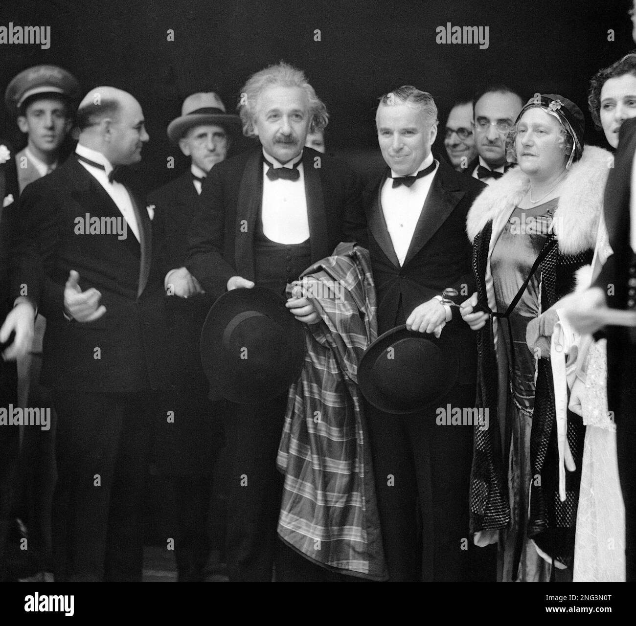 Dr. Albert Einstein, center, a German physicist, stands with his wife ...