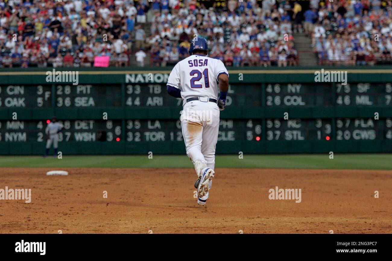 Texas Rangers' Sammy Sosa runs the bases after hitting his 600th career ...