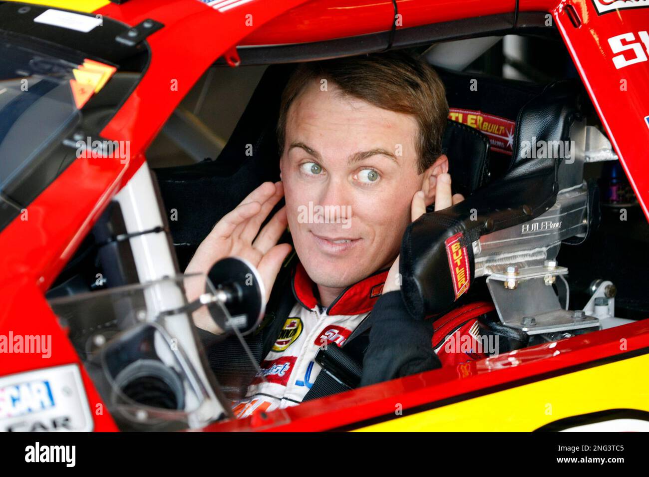 NASCAR Busch driver Kevin Harvick talks to his crew mamber inside the ...