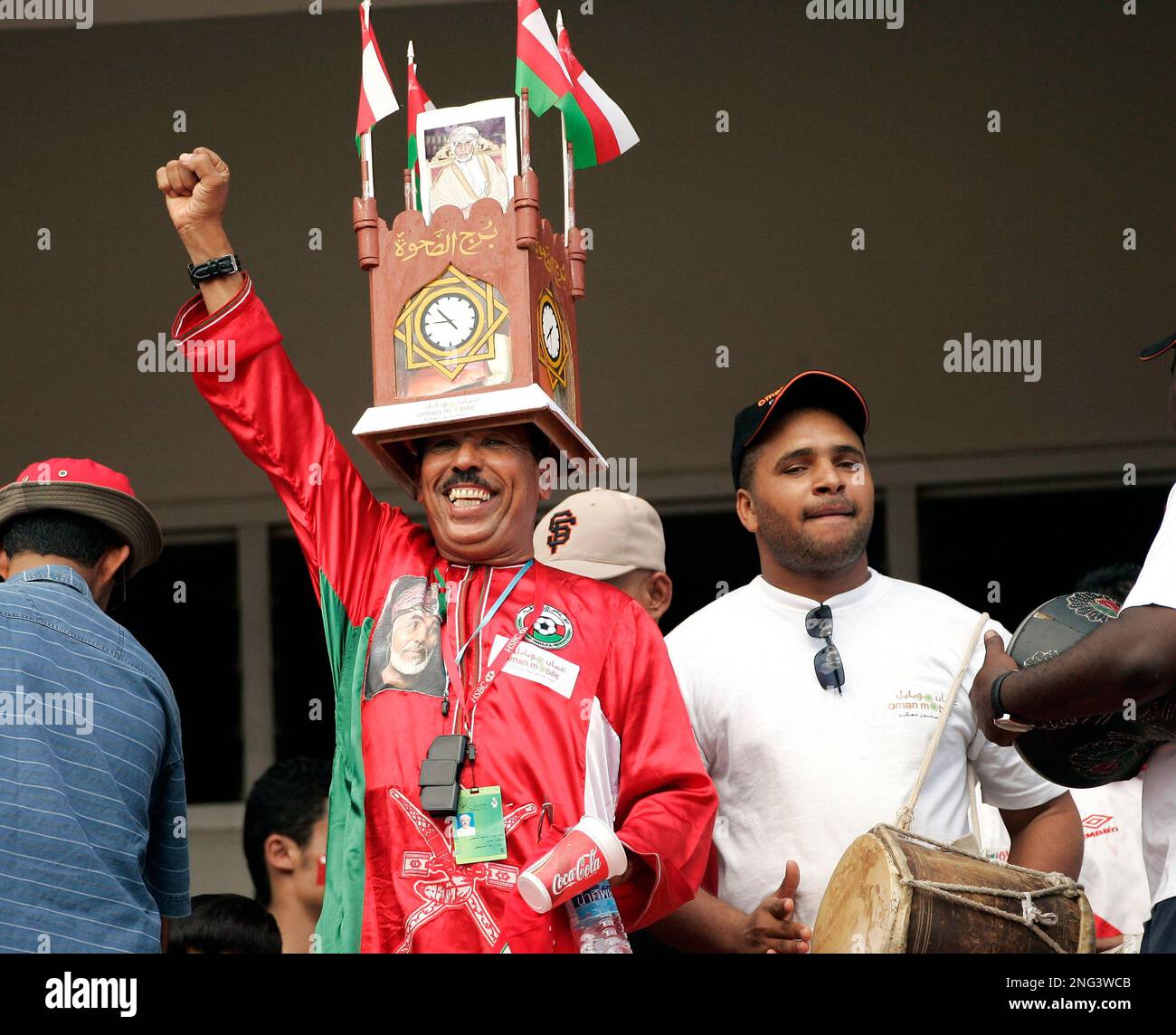 Oman soccer fans celebrate the arrival of their team for a group A ...