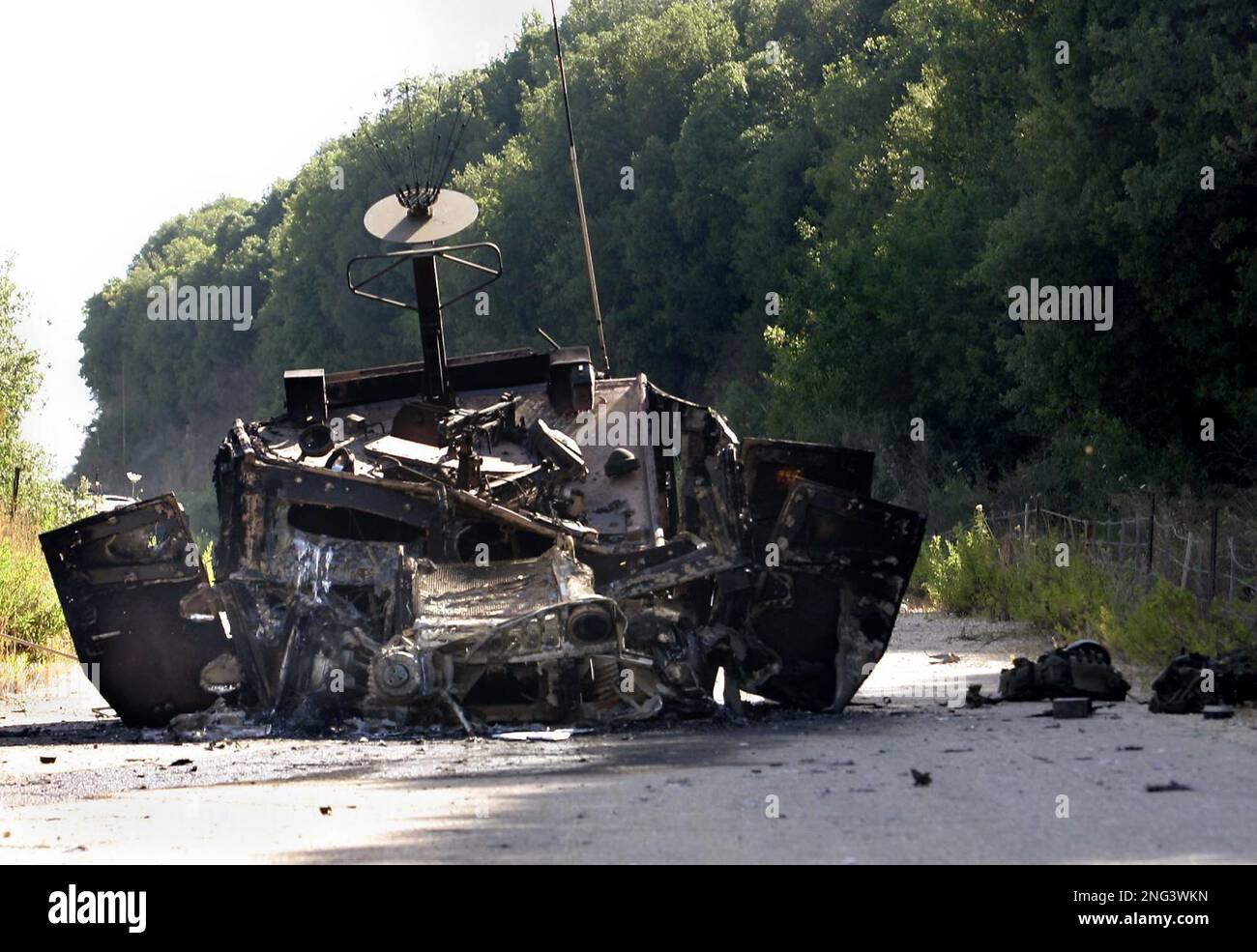 ** FILE ** A burned Israeli humvee that was part of a convoy attacked ...