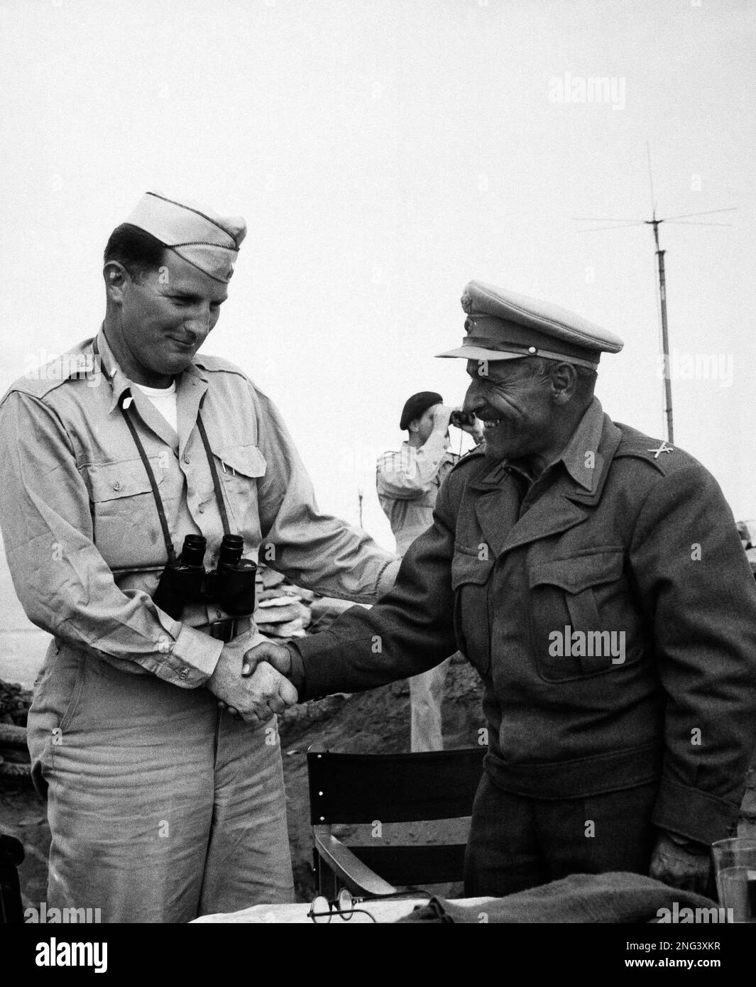 First Lt. Francis G. Murphy, left, shakes hands with Brigadier ...