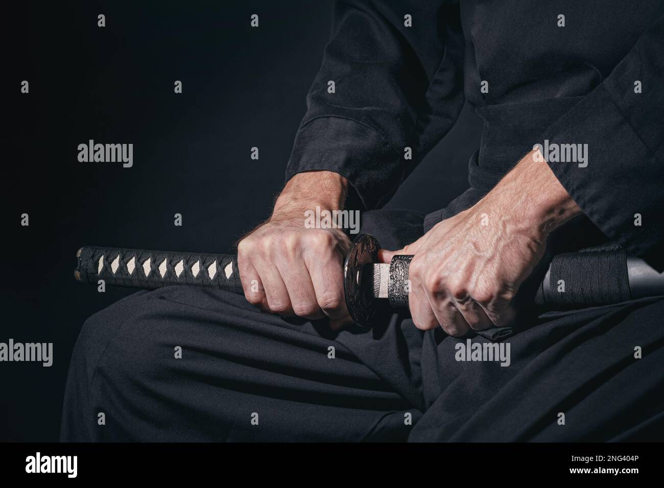 The samurai holding a Japanese katana sword. Photo of a warrior dressed ...